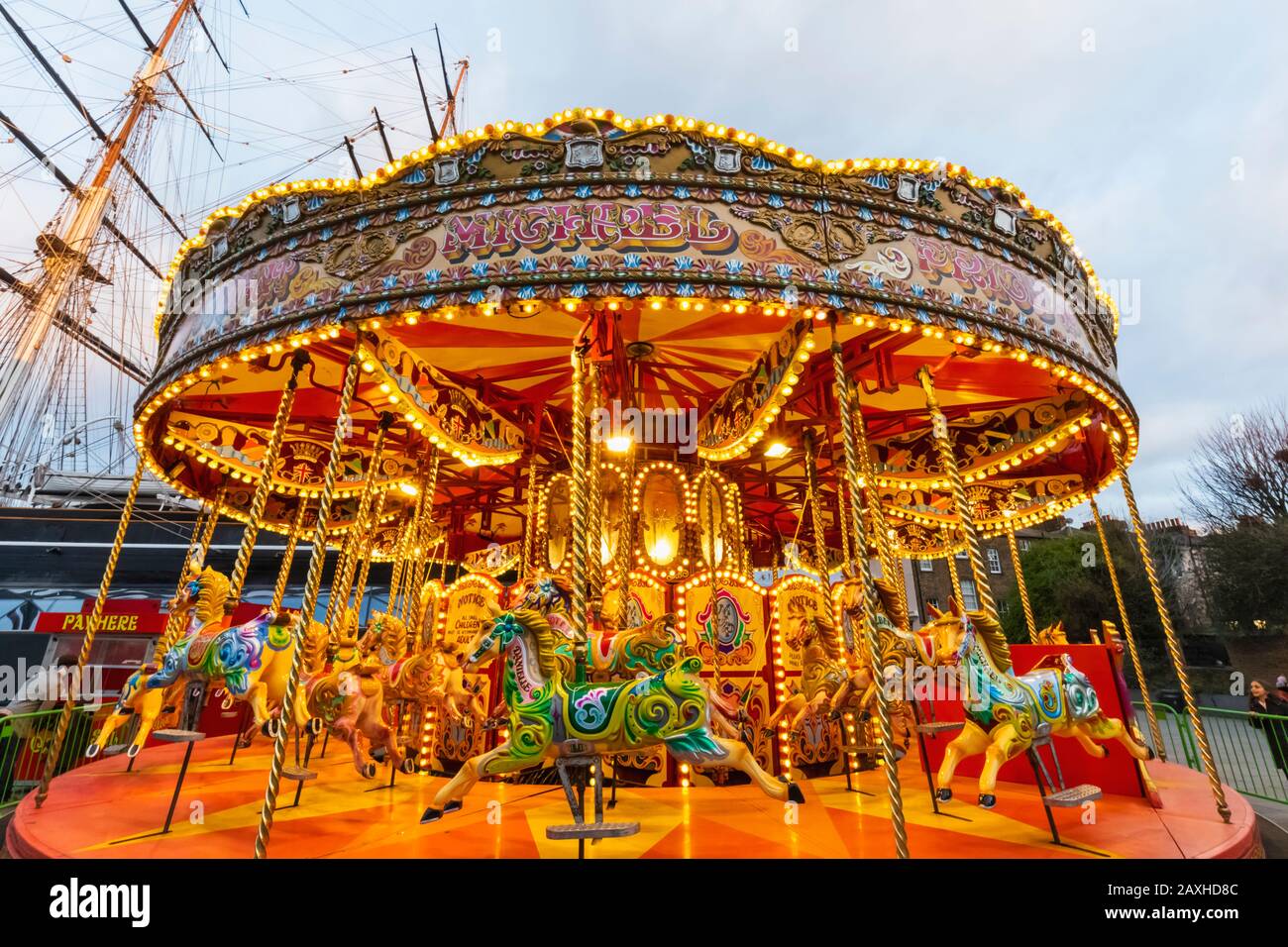 England, London, Greenwich, Fairground Carousel in front of the Cutty ...
