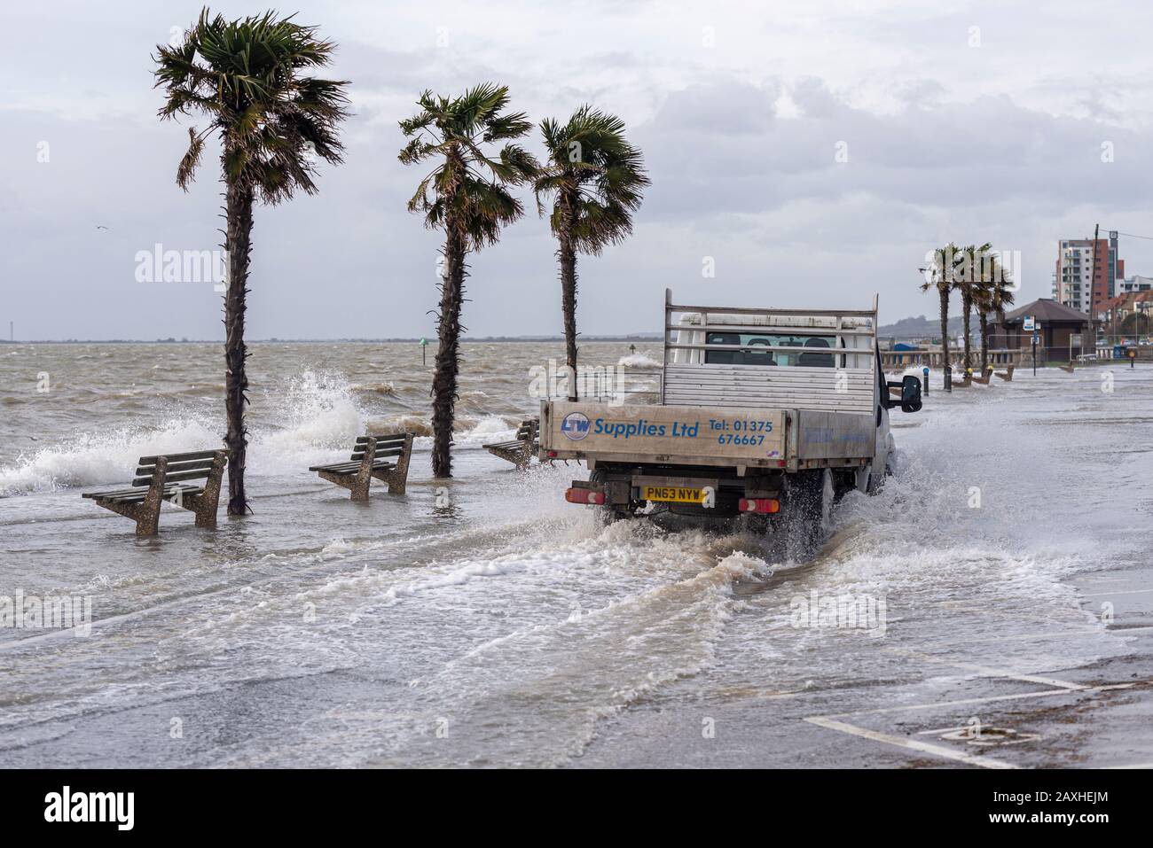 Truck driving through deep flooding during the high tide storm surge ...