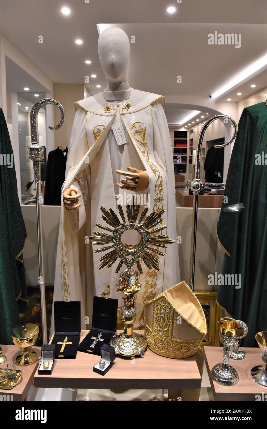 RELIGIOUS CLOTHES AND OBJECTS ON DISPLAY IN A SHOP IN THE HISTORIC ...