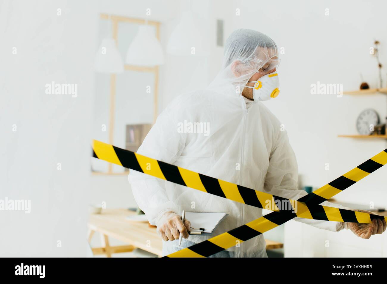 he epidemiologist in the zone of infection, surrounded by a warning ...