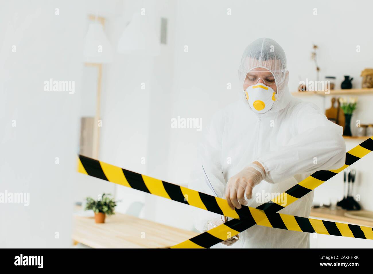 he epidemiologist in the zone of infection, surrounded by a warning ...