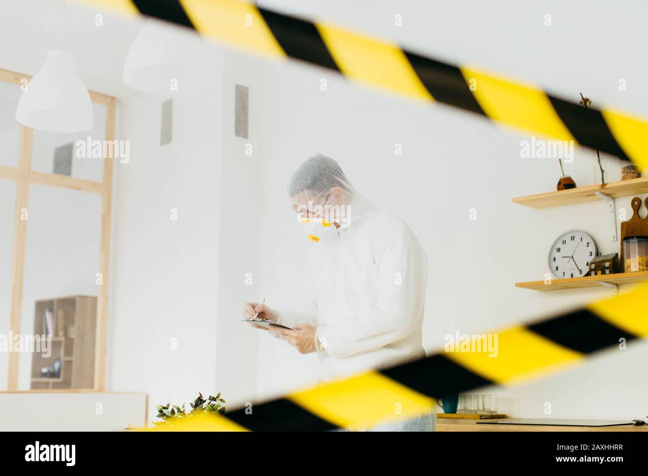 he epidemiologist in the zone of infection, surrounded by a warning ...