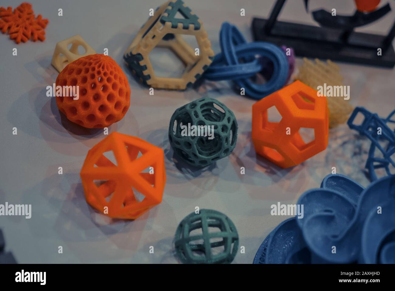 Models printed by 3d printer. Dark. Bright colorful objects printed on ...
