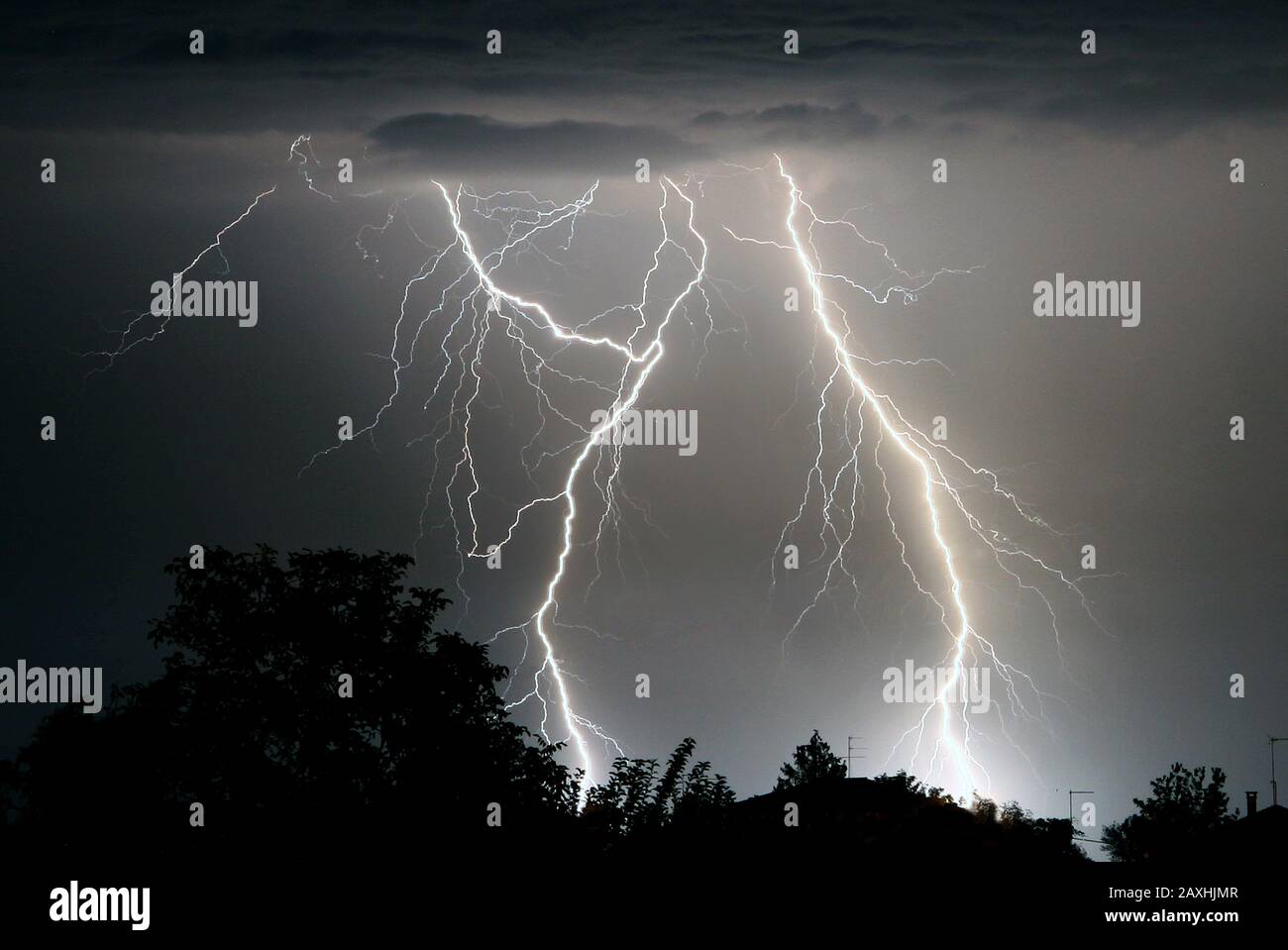 Lightning strikes during a heavy storm in Italy Stock Photo - Alamy