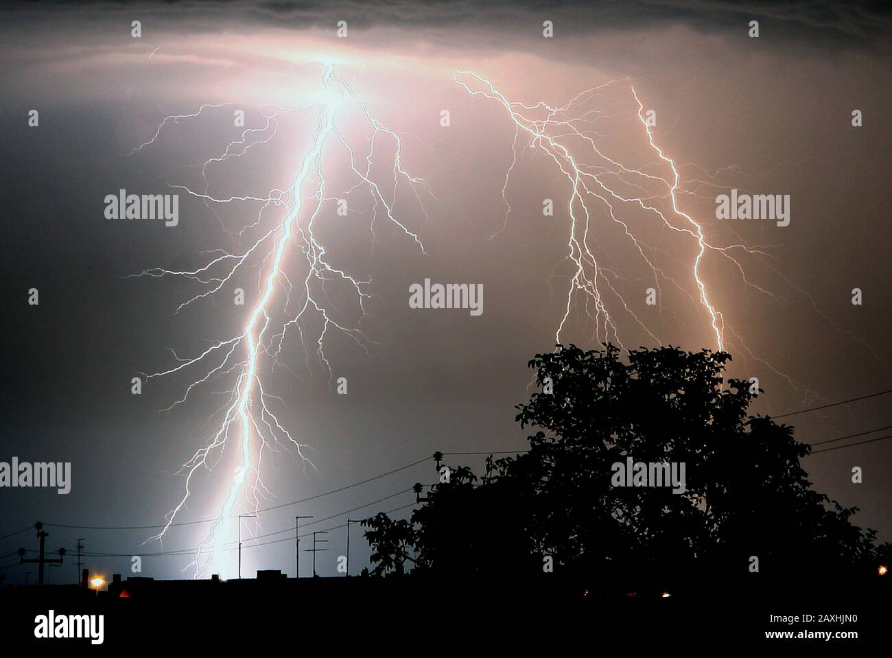 Lightning strikes during a heavy storm in Italy Stock Photo - Alamy