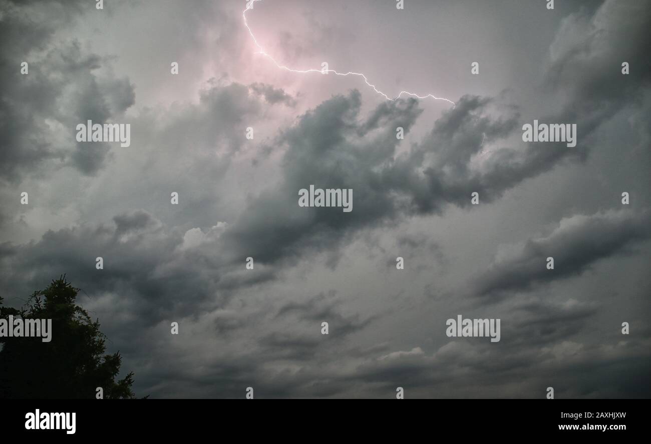 Lightning strikes during a heavy storm in Italy Stock Photo - Alamy