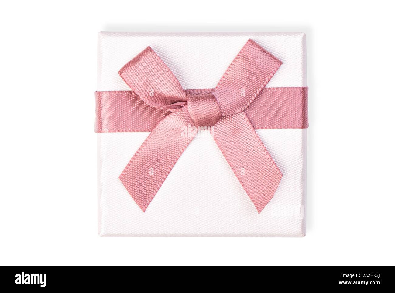 White box for jewelry with a pink bow isolated on white background ...