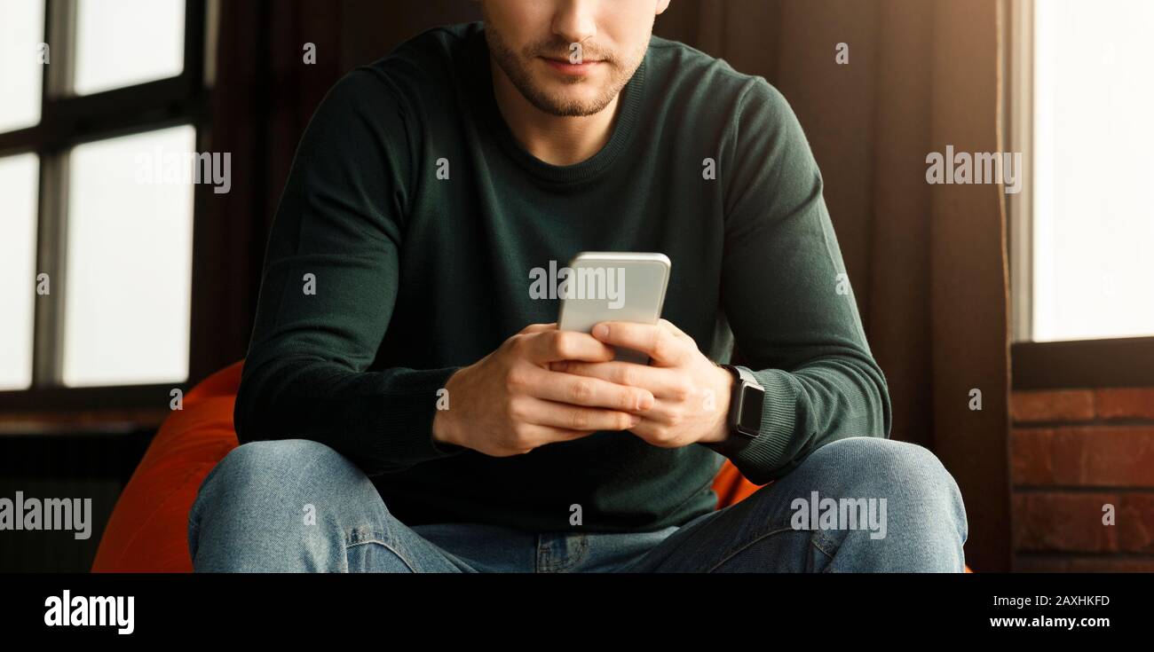 Phone game adult chair hi-res stock photography and images - Alamy