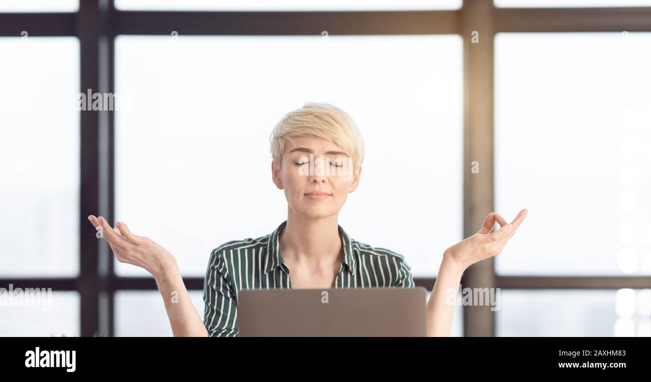 Calm Business Lady Meditating During Stressful Day At Workplace ...