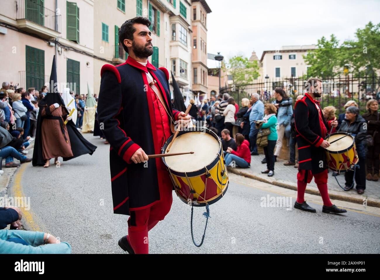 Holy Thursday procession of church brotherhood penitents in conical ...
