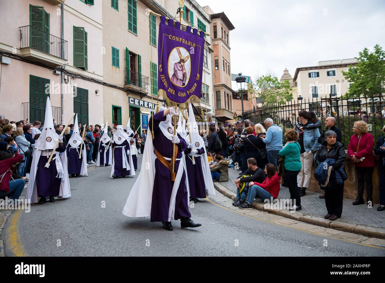 Holy Thursday procession of church brotherhood penitents in conical ...