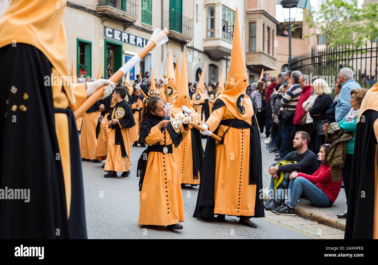 Holy Thursday procession of church brotherhood penitents in conical ...