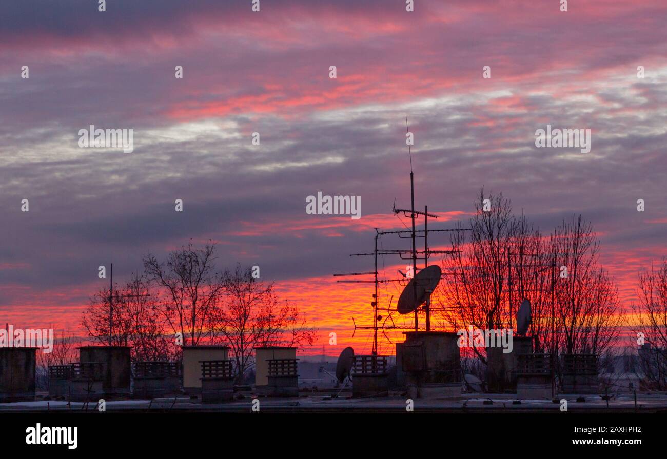 Scenery of sunset in zagreb with antennas on the top of the building ...
