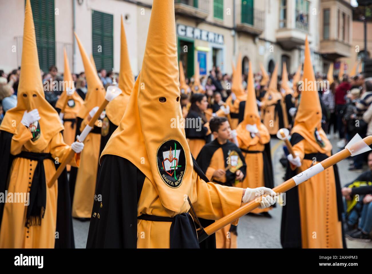 Holy Thursday procession of church brotherhood penitents in conical ...