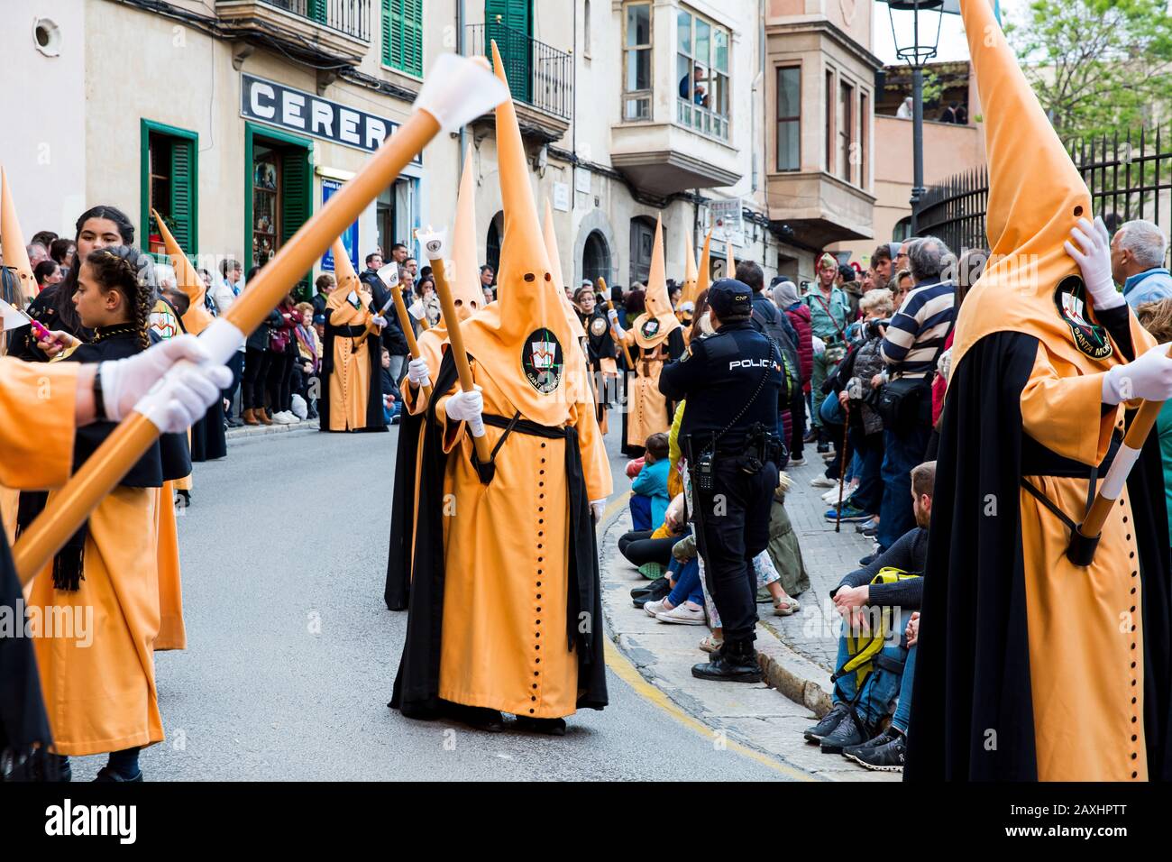 Holy Thursday procession of church brotherhood penitents in conical ...