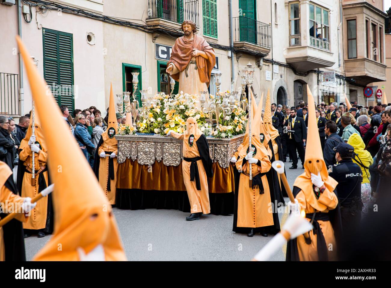 Holy Thursday procession of church brotherhood penitents in conical ...