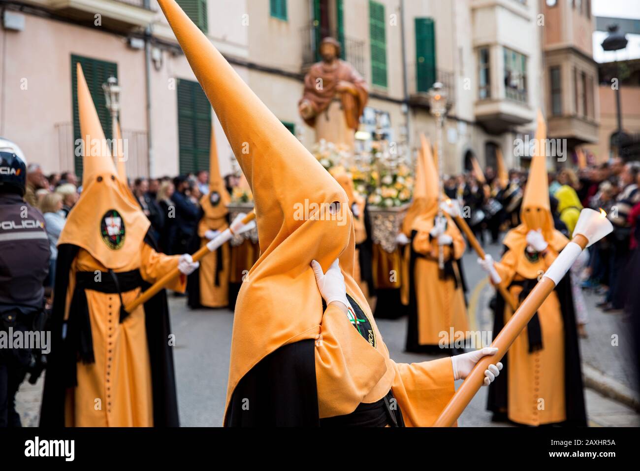 Holy Thursday procession of church brotherhood penitents in conical ...