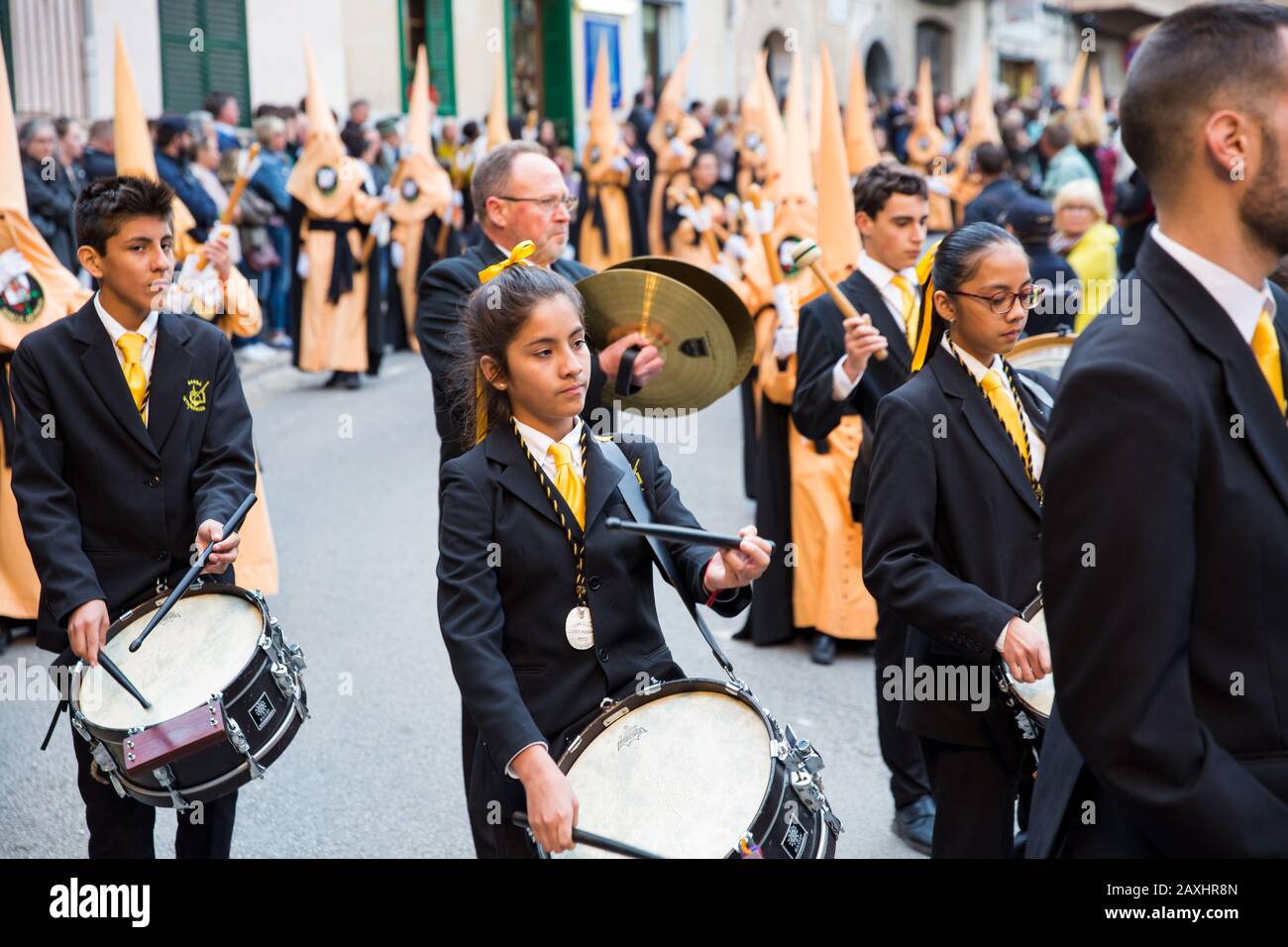 Holy Thursday procession of church brotherhood penitents in conical ...