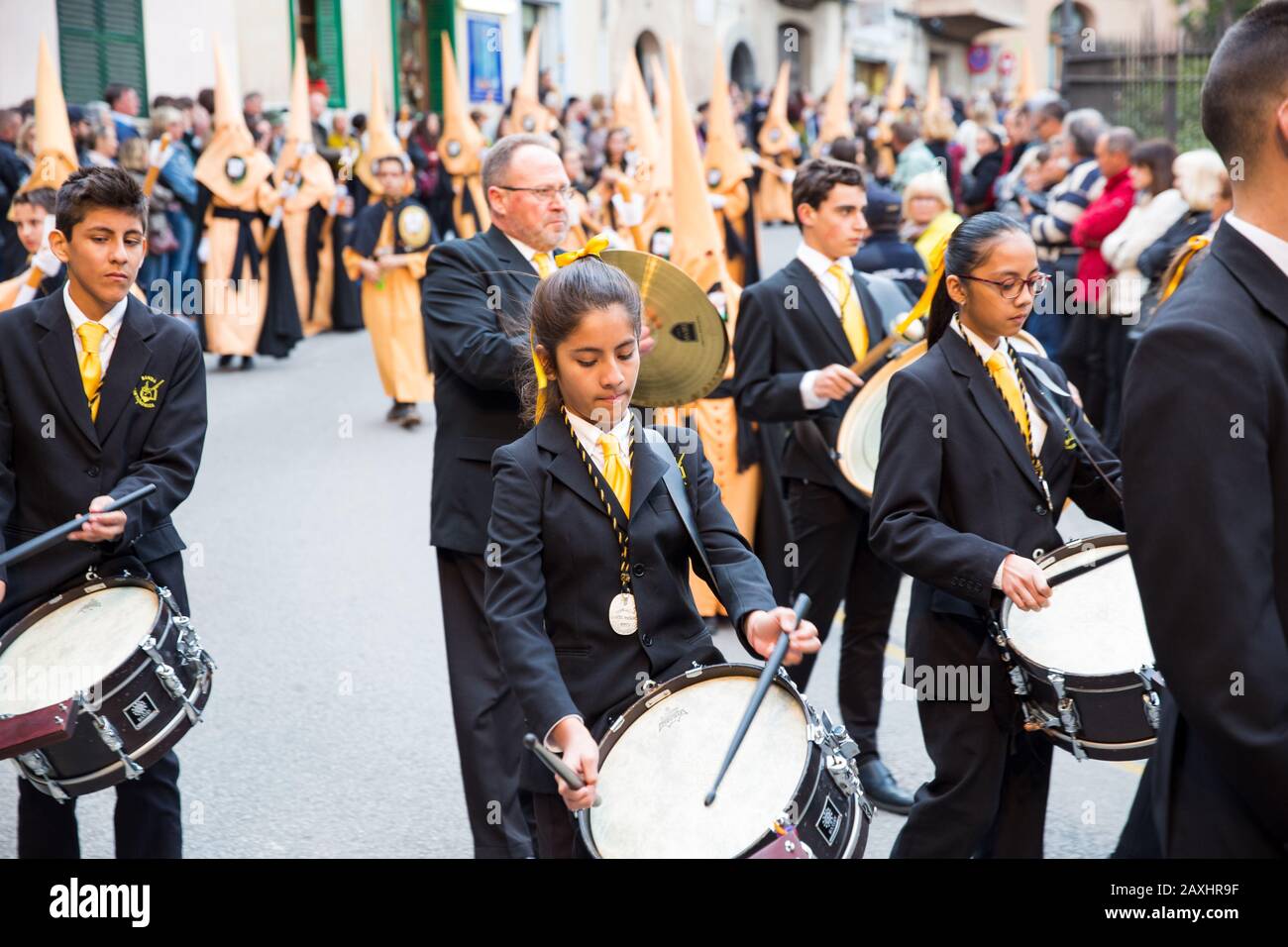 Holy Thursday procession of church brotherhood penitents in conical ...