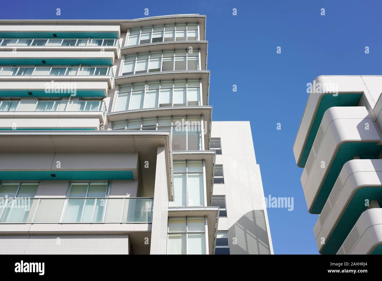 Modern white hospital building with sky in Japan Stock Photo - Alamy