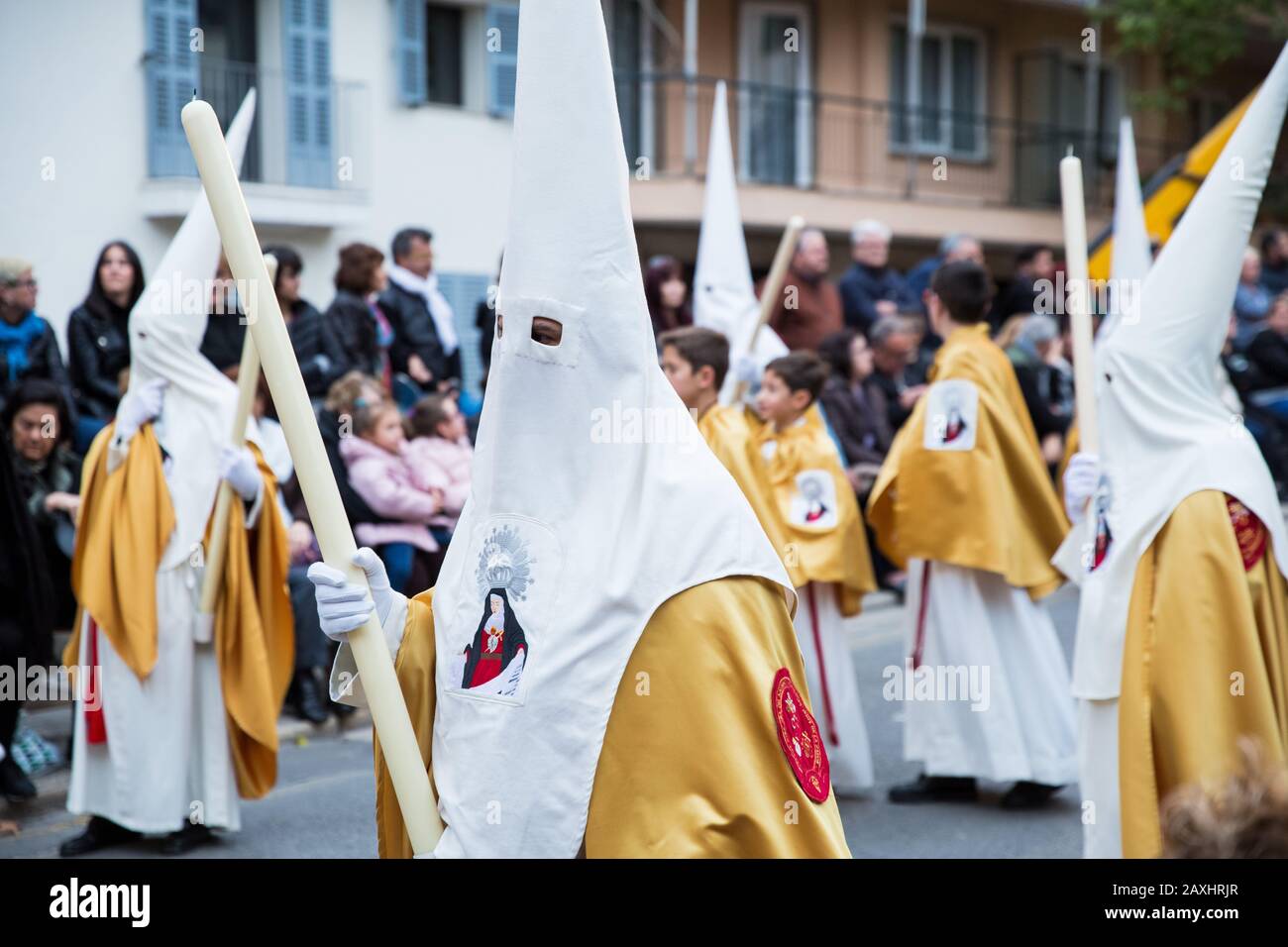 Holy Thursday procession of church brotherhood penitents in conical ...