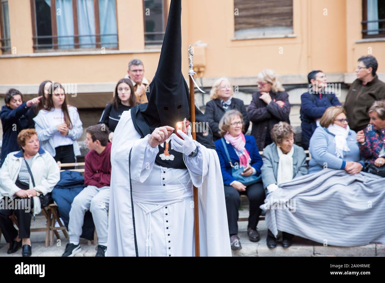 Holy Thursday procession of church brotherhood penitents in conical ...