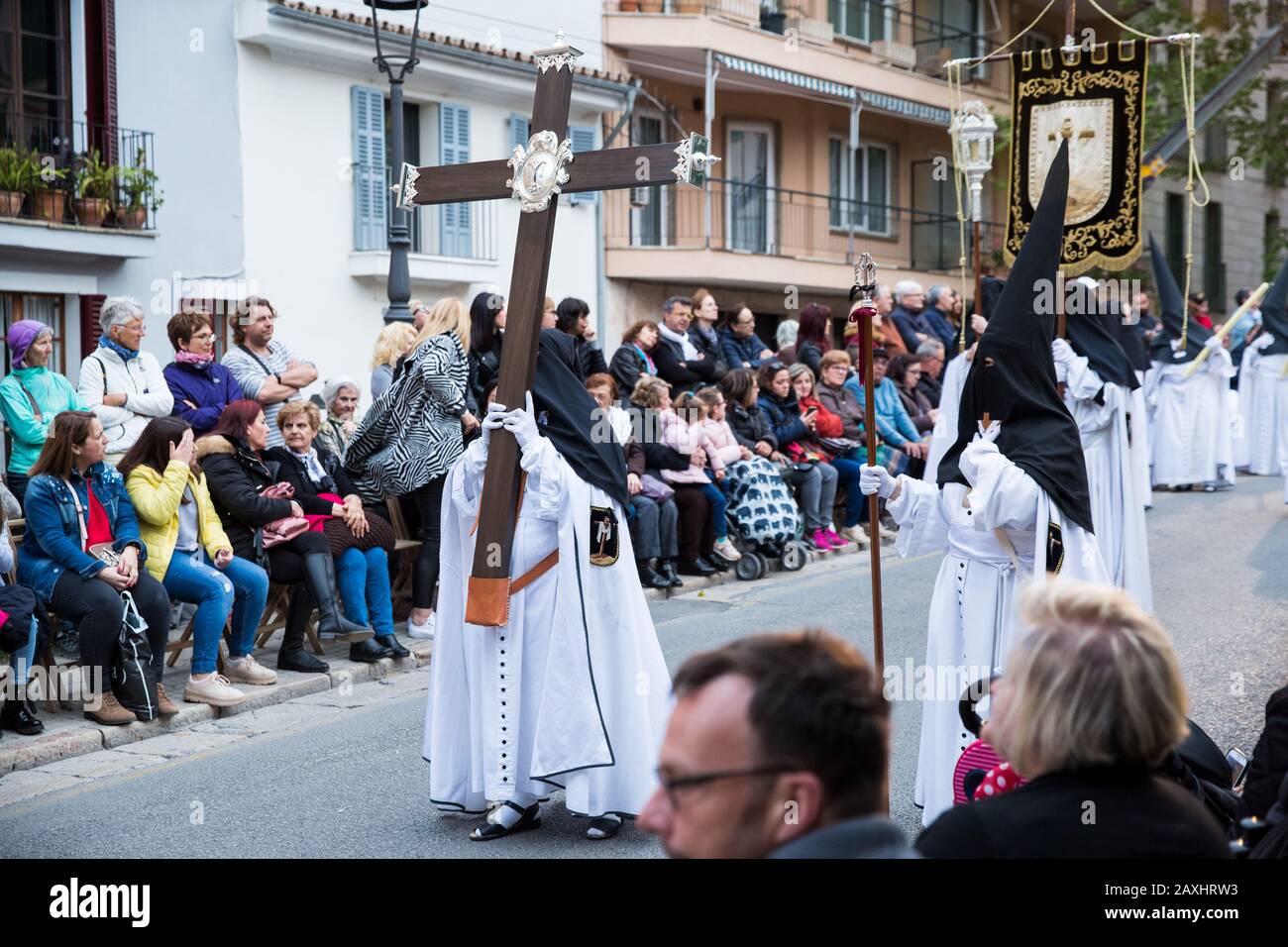 Holy Thursday procession of church brotherhood penitents in conical ...