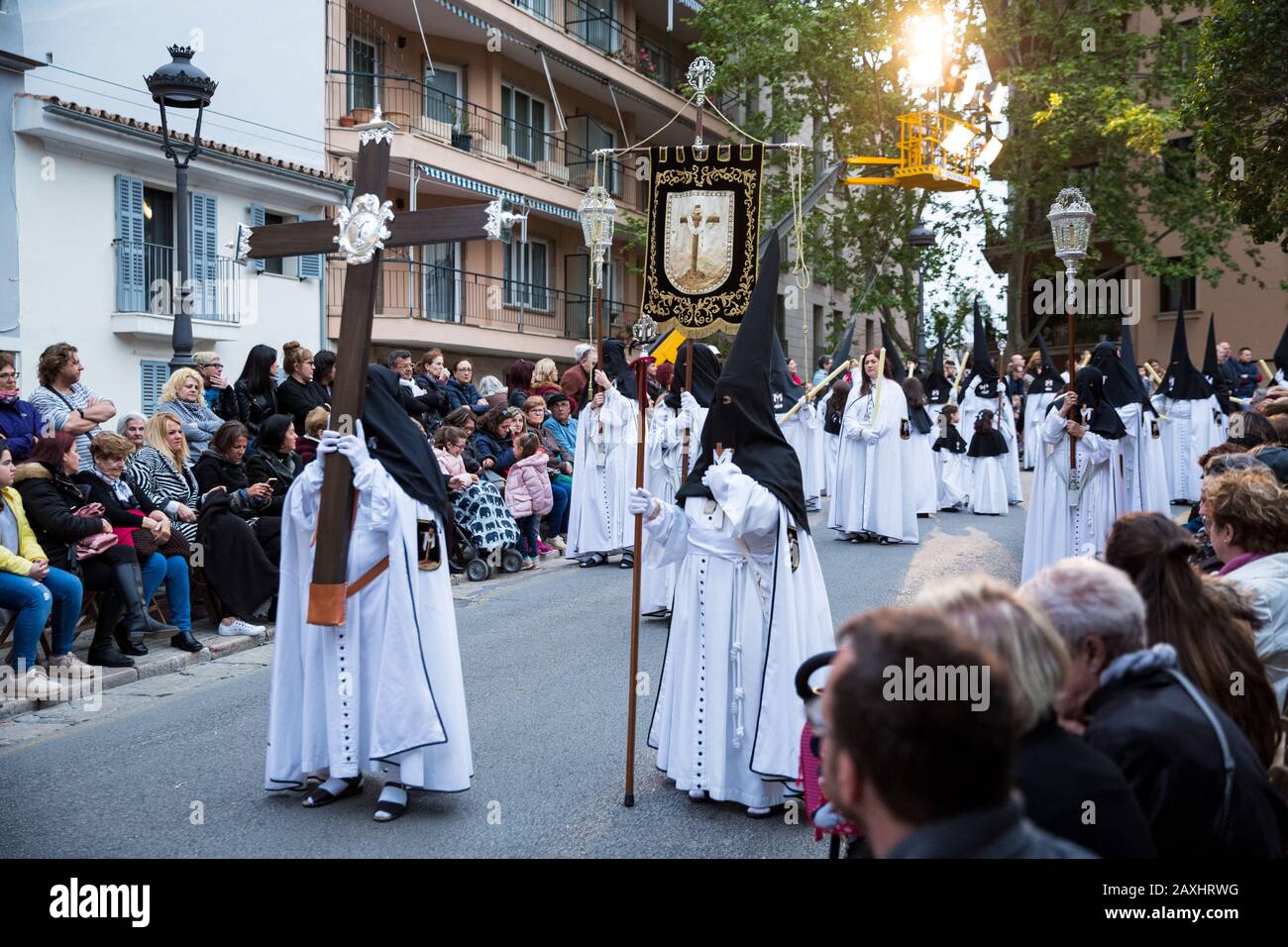 Holy Thursday procession of church brotherhood penitents in conical ...