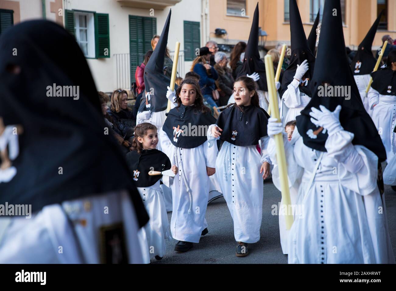 Holy Thursday procession of church brotherhood penitents in conical ...