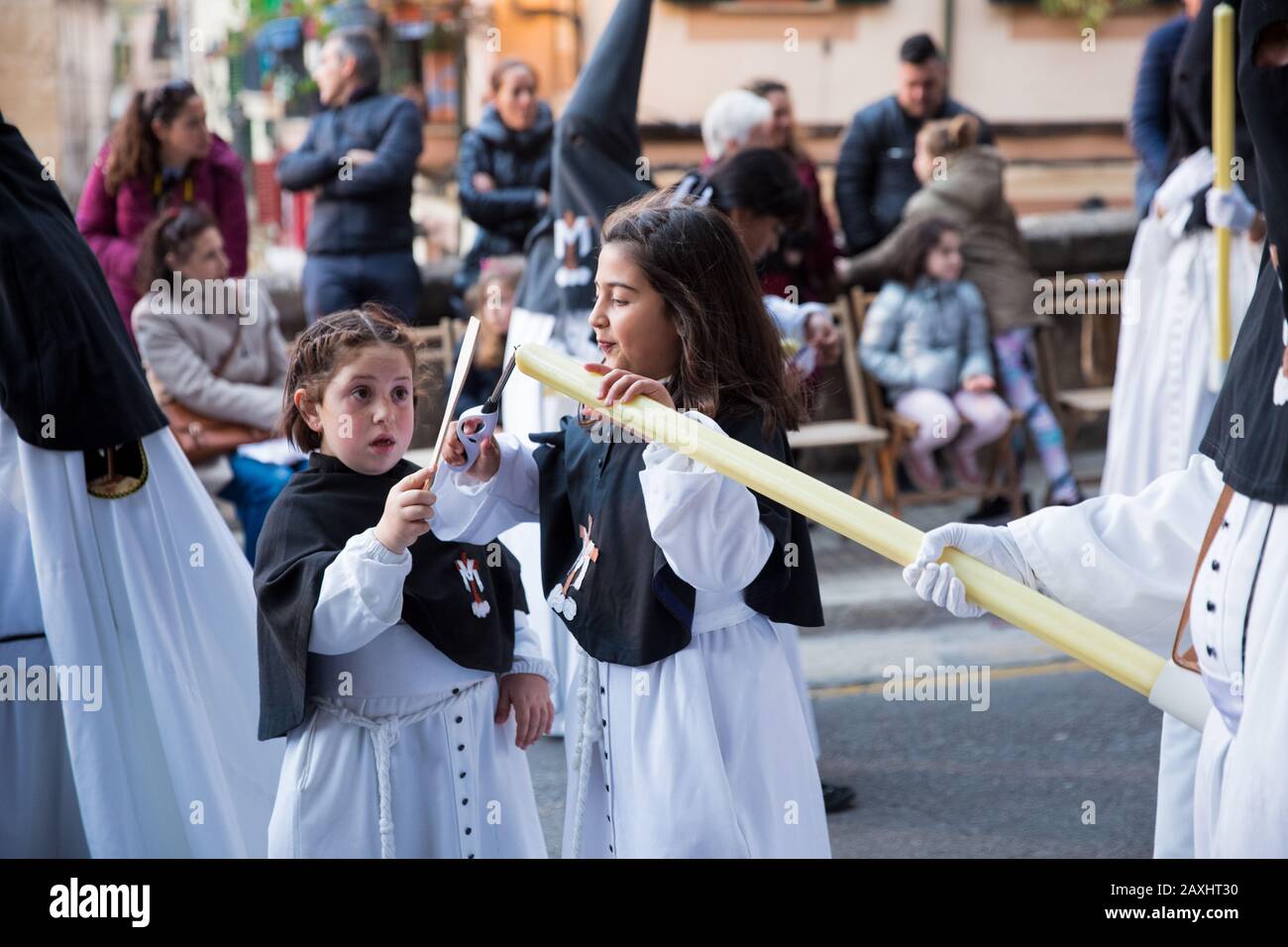 Holy Thursday procession of church brotherhood penitents in conical ...