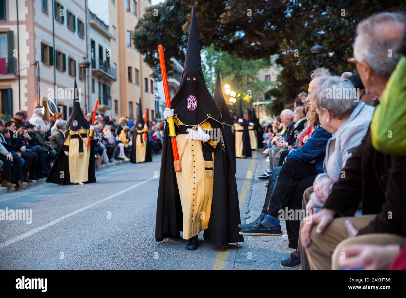 Holy Thursday procession of church brotherhood penitents in conical ...