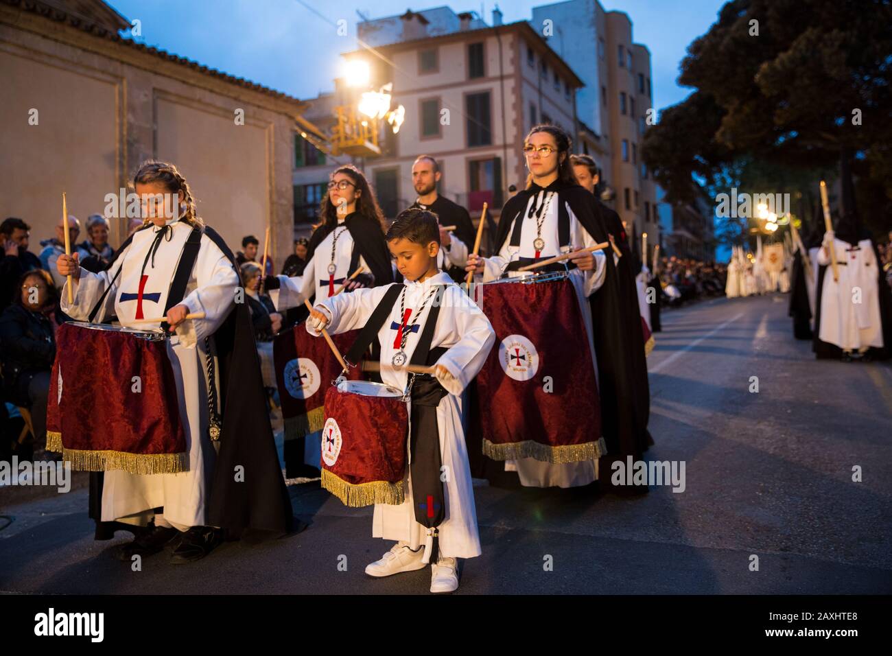 Holy Thursday procession of church brotherhood penitents in conical ...