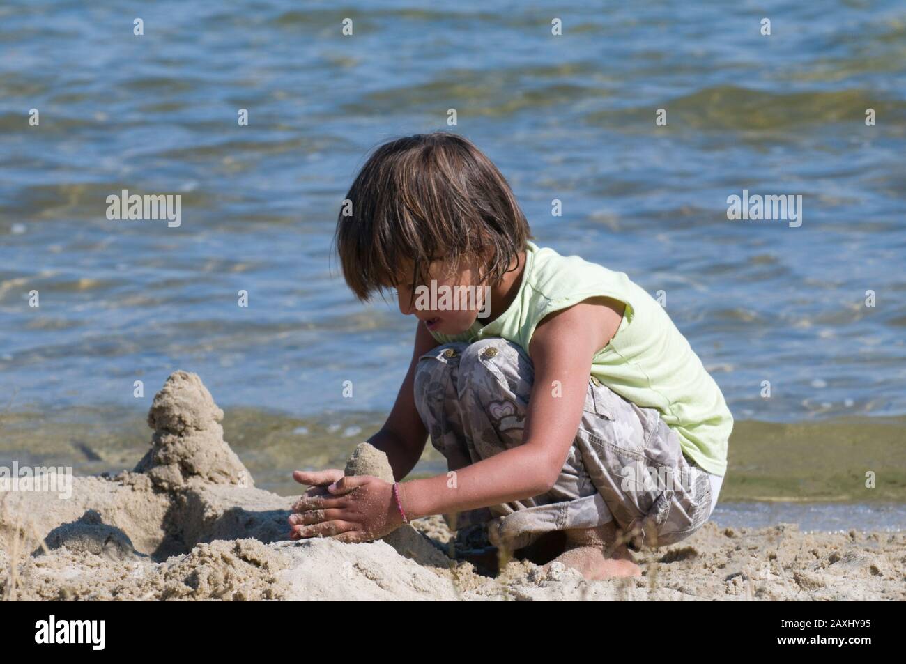 Builds sand castle hi-res stock photography and images - Alamy