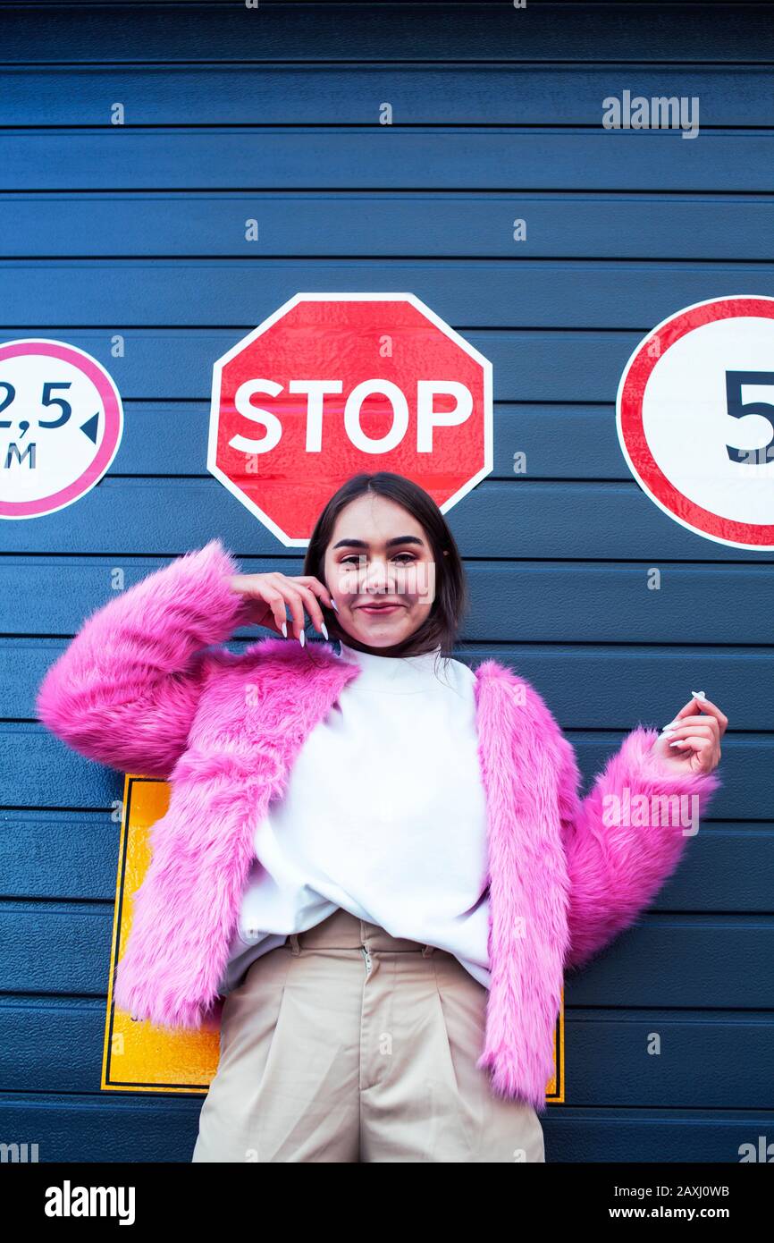young cute girl teenager gesturing hanging around city parking and ...