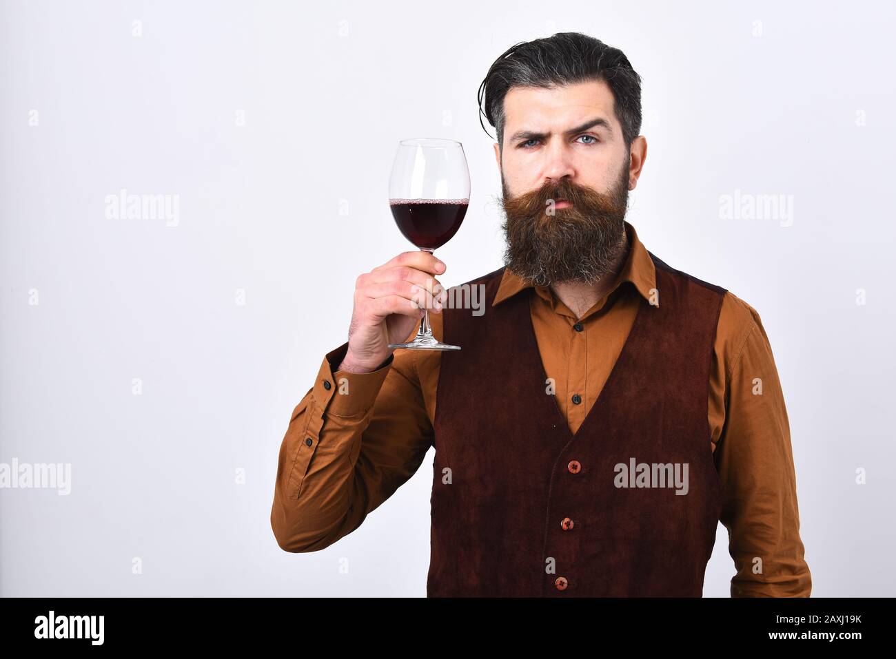 Waiter with tray and glass of red wine. Barman with confident face ...