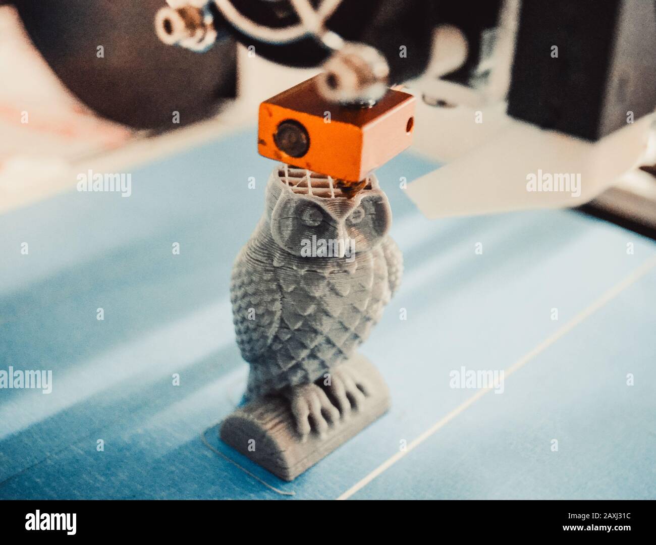 HD 1080 3D printer prints, creates, pouring, yellow a figure, shape of ...