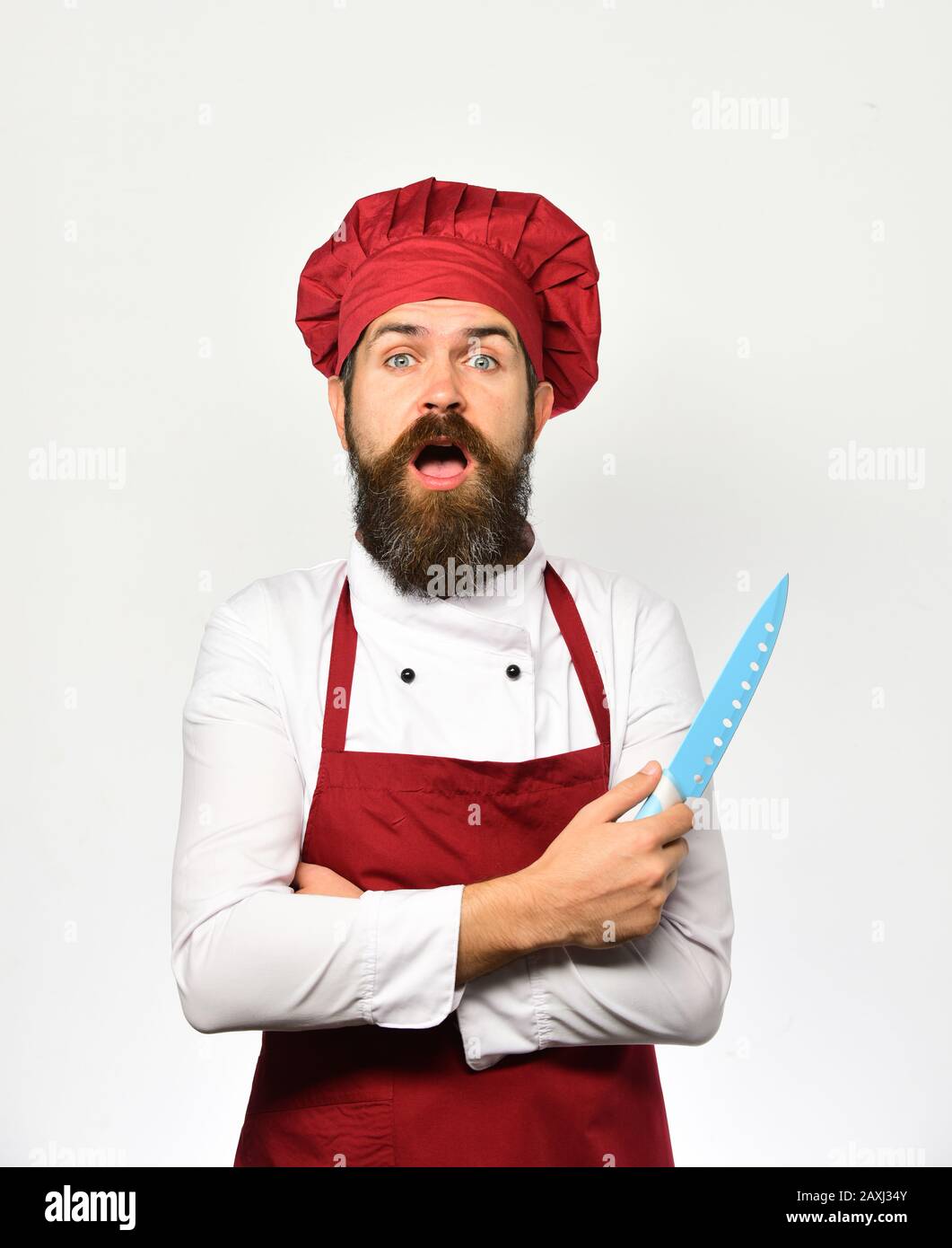 Cooking equipment and cuisine concept. Cook with surprised face in ...