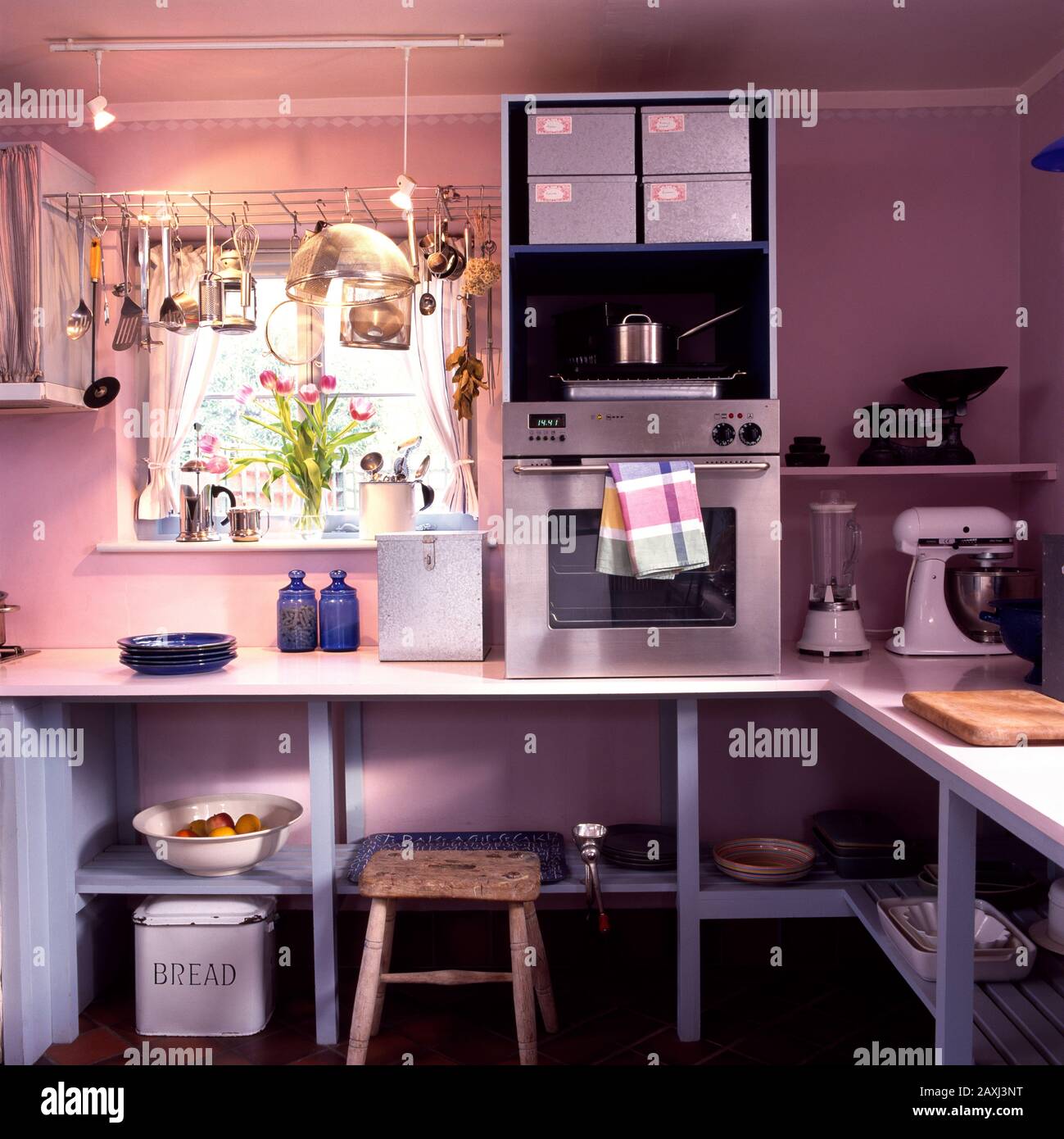 Simple modern kitchen with wall hung storage Stock Photo - Alamy