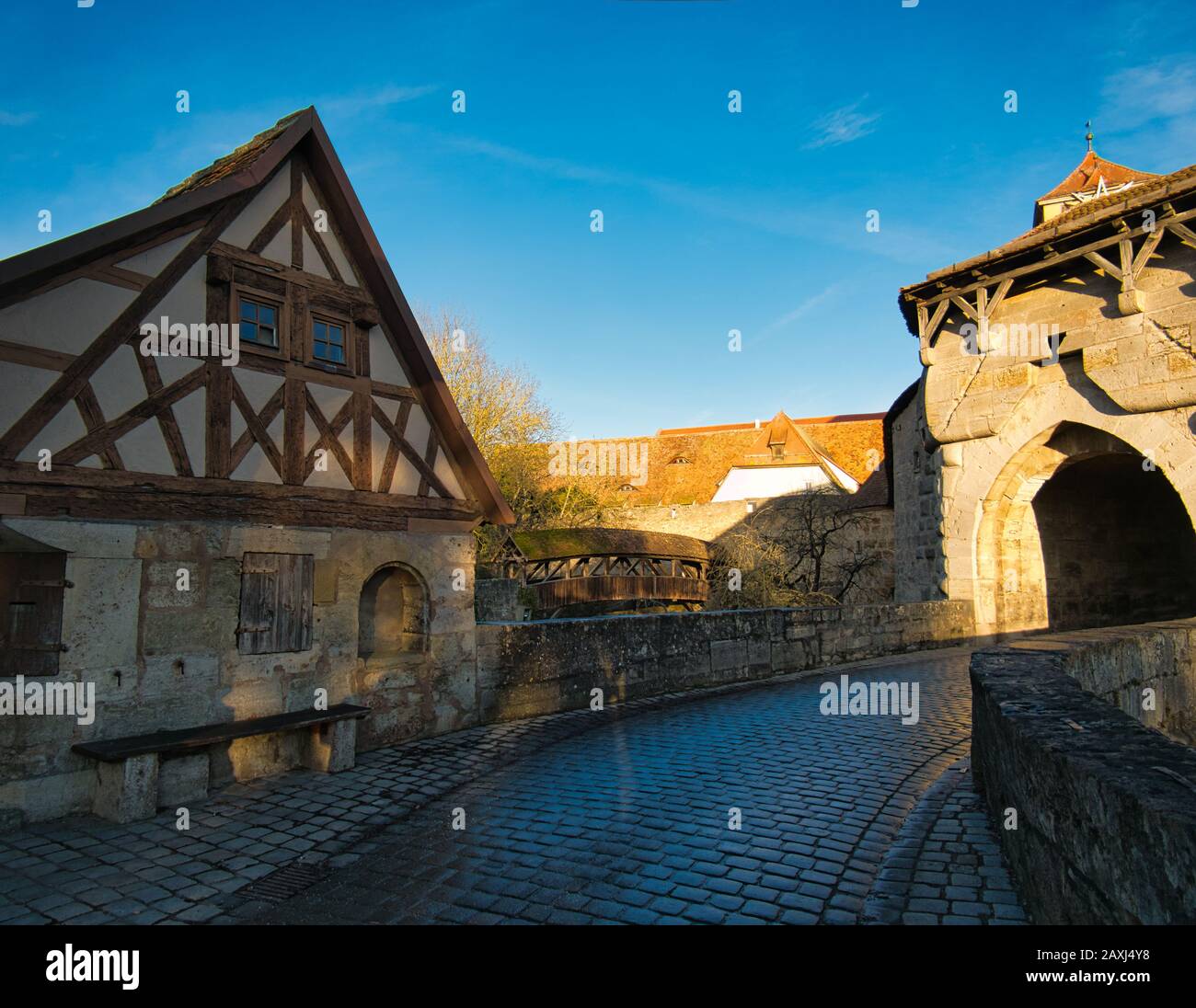 Medieval town gate in Rothenburg ob der Tauber with cobblestone ...