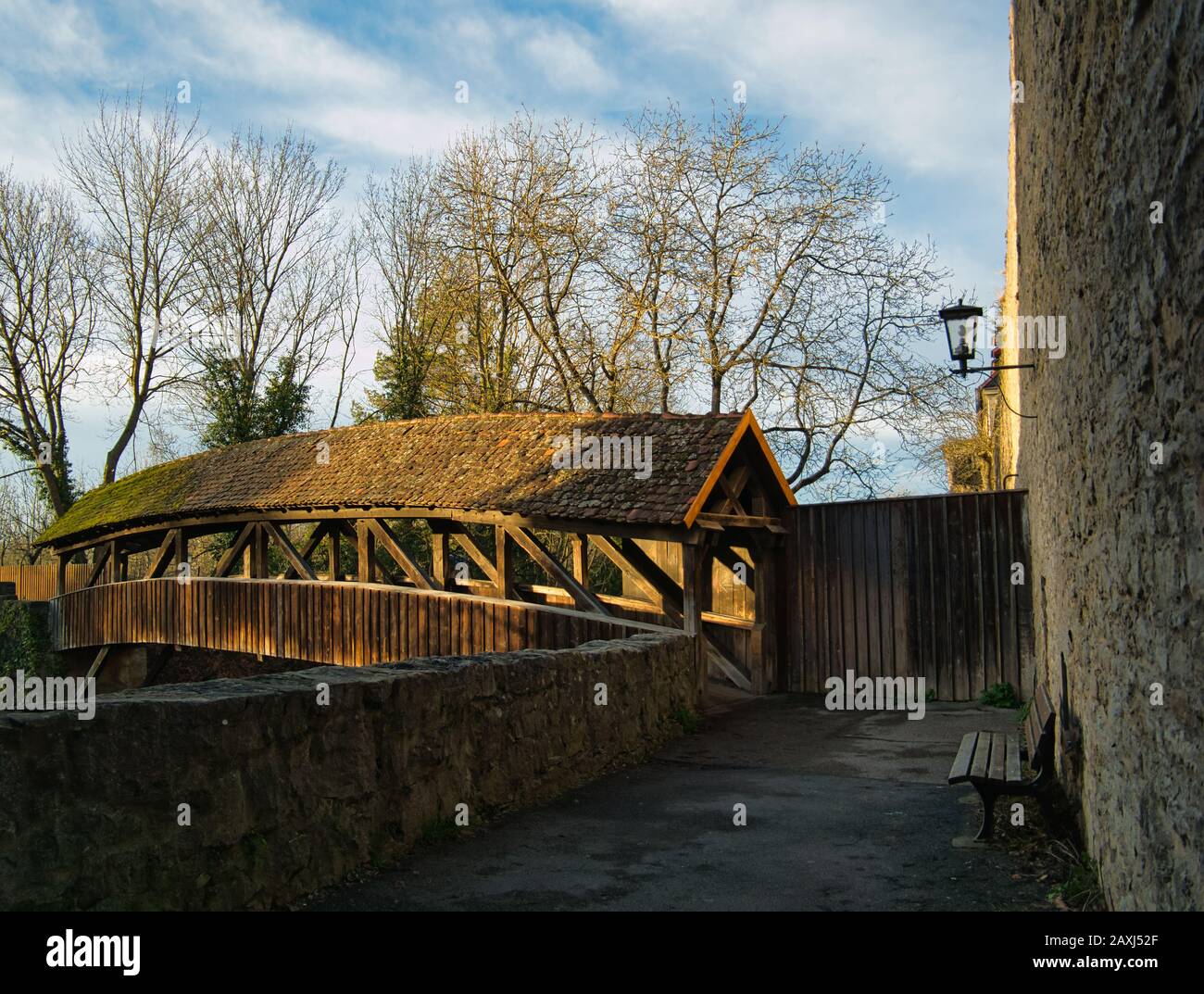 An old bridge over the moat at the city wall of Rothenburg Stock Photo ...