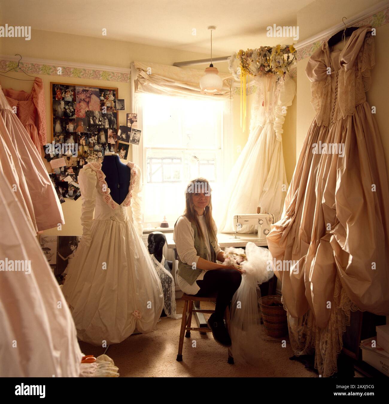 Wedding dress designer at work in studio Stock Photo - Alamy