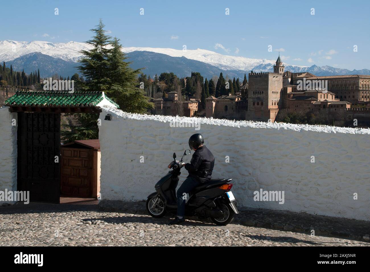 Granada Spain, Street view with Alhambra and Sierra Nevada mountains in ...