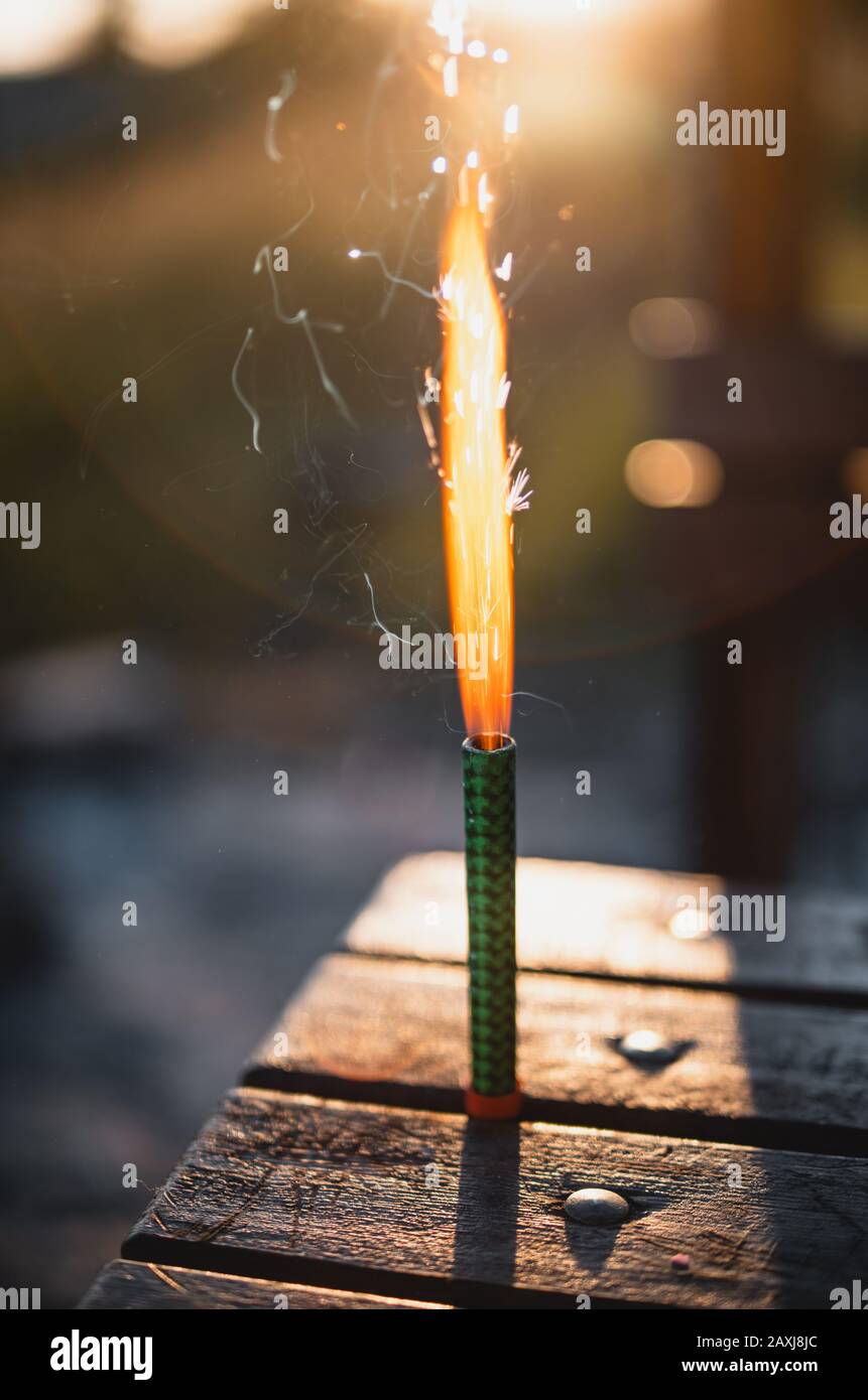 Fireworks burning on the table outside. Celebration Concept Stock Photo ...