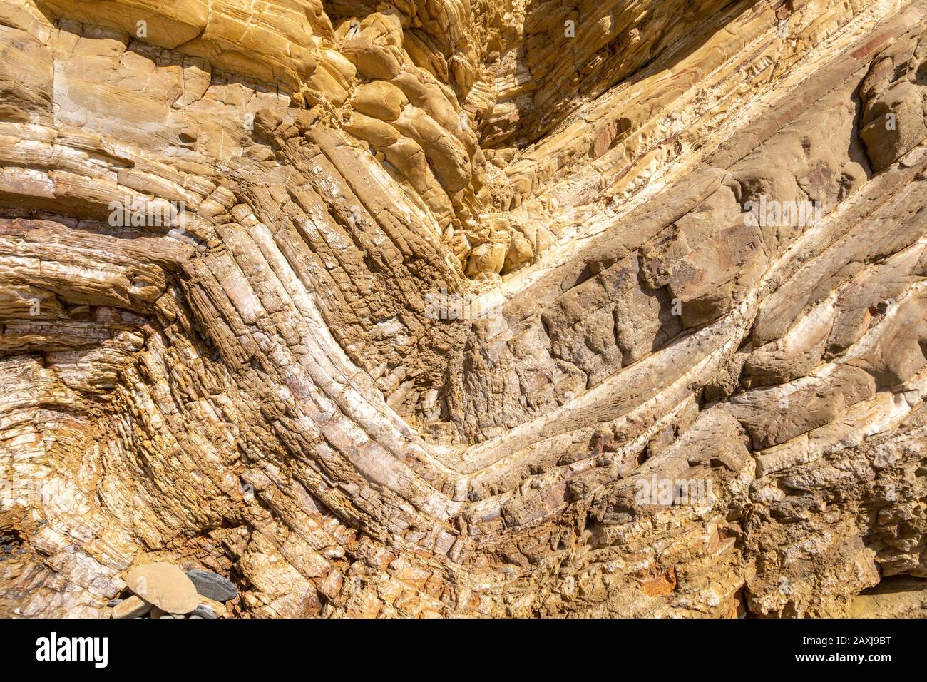 Strata of sandstone sedimentary rock coastal cliff layers folded ...