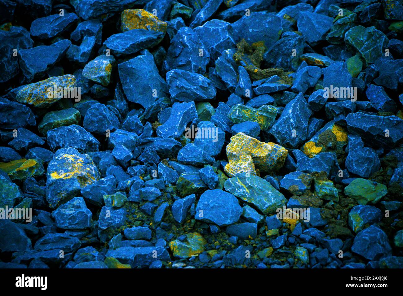 Several blue gravel stones on the ground Stock Photo - Alamy
