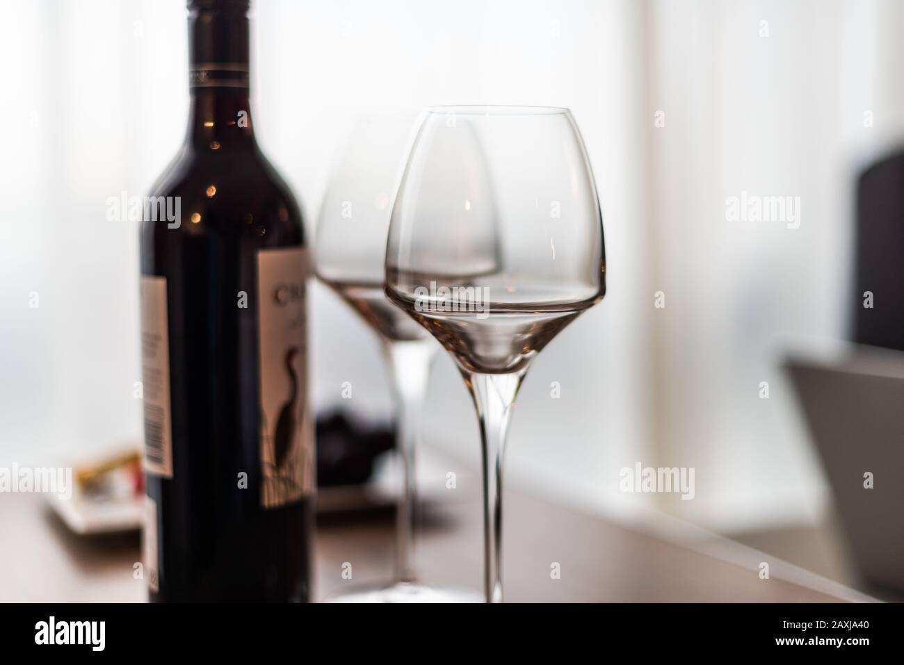 Hotel Wine Bottle and glass Set up with canapé Stock Photo - Alamy