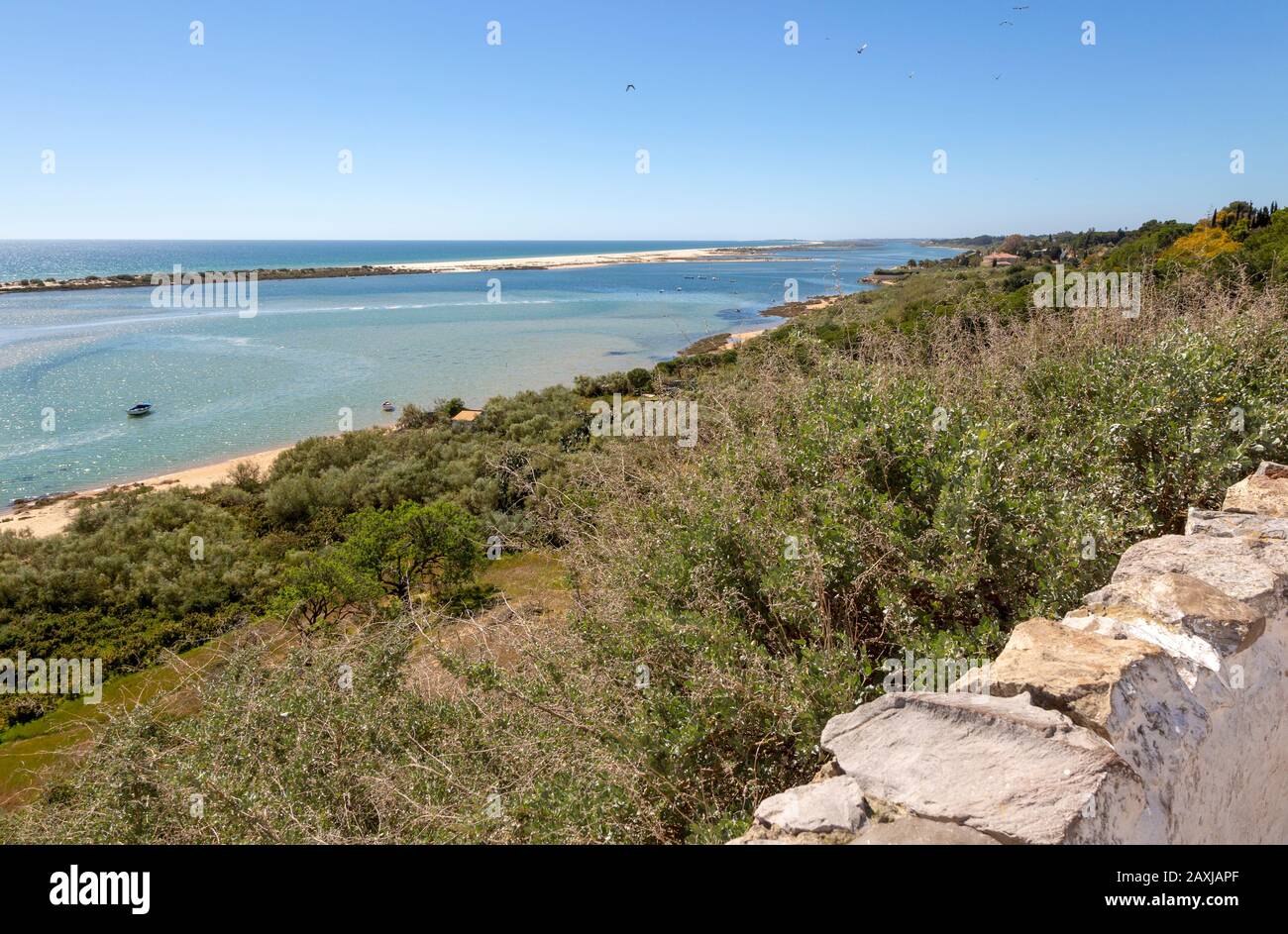 Coastal wooded landscape of pristine beaches and lagoon behind offshore ...
