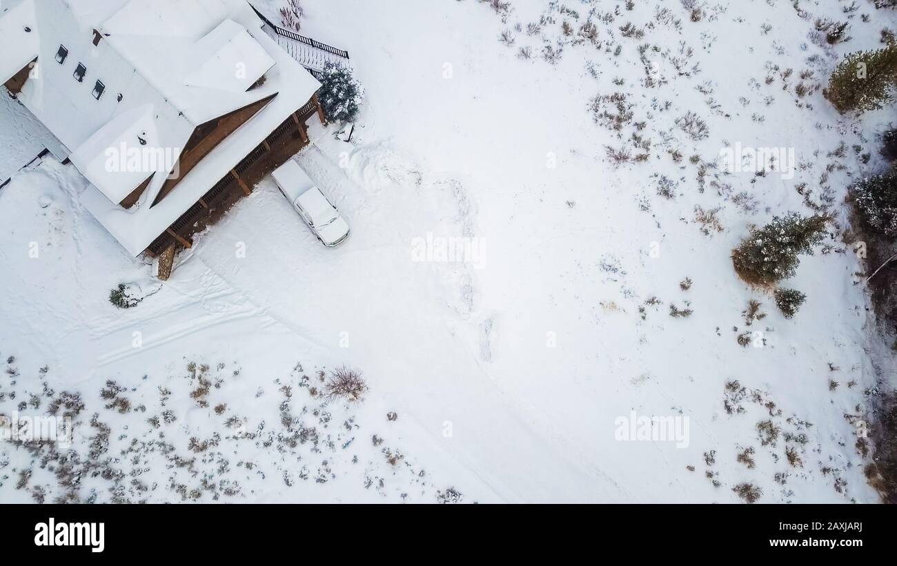 Aerial view of the mountain house covered in snow in the Winter Stock ...