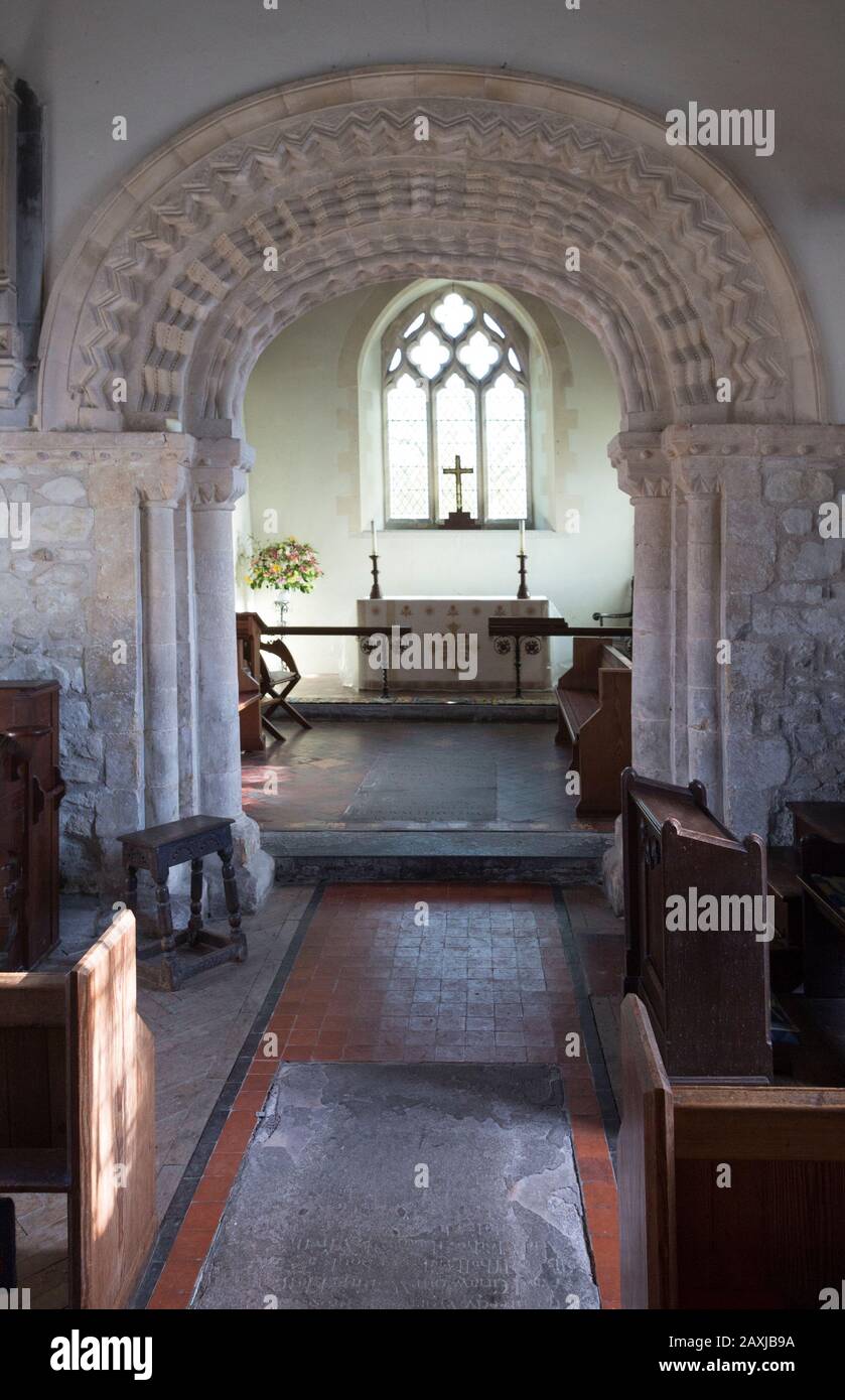 Elaborately decorated stone 12th century Norman chancel arch inside the ...