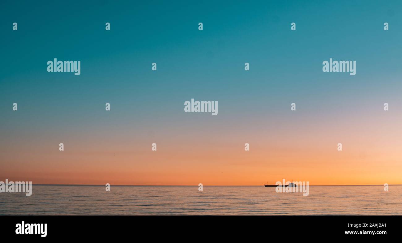 Sea horizon line and sunset photo. Landscape concept Stock Photo - Alamy